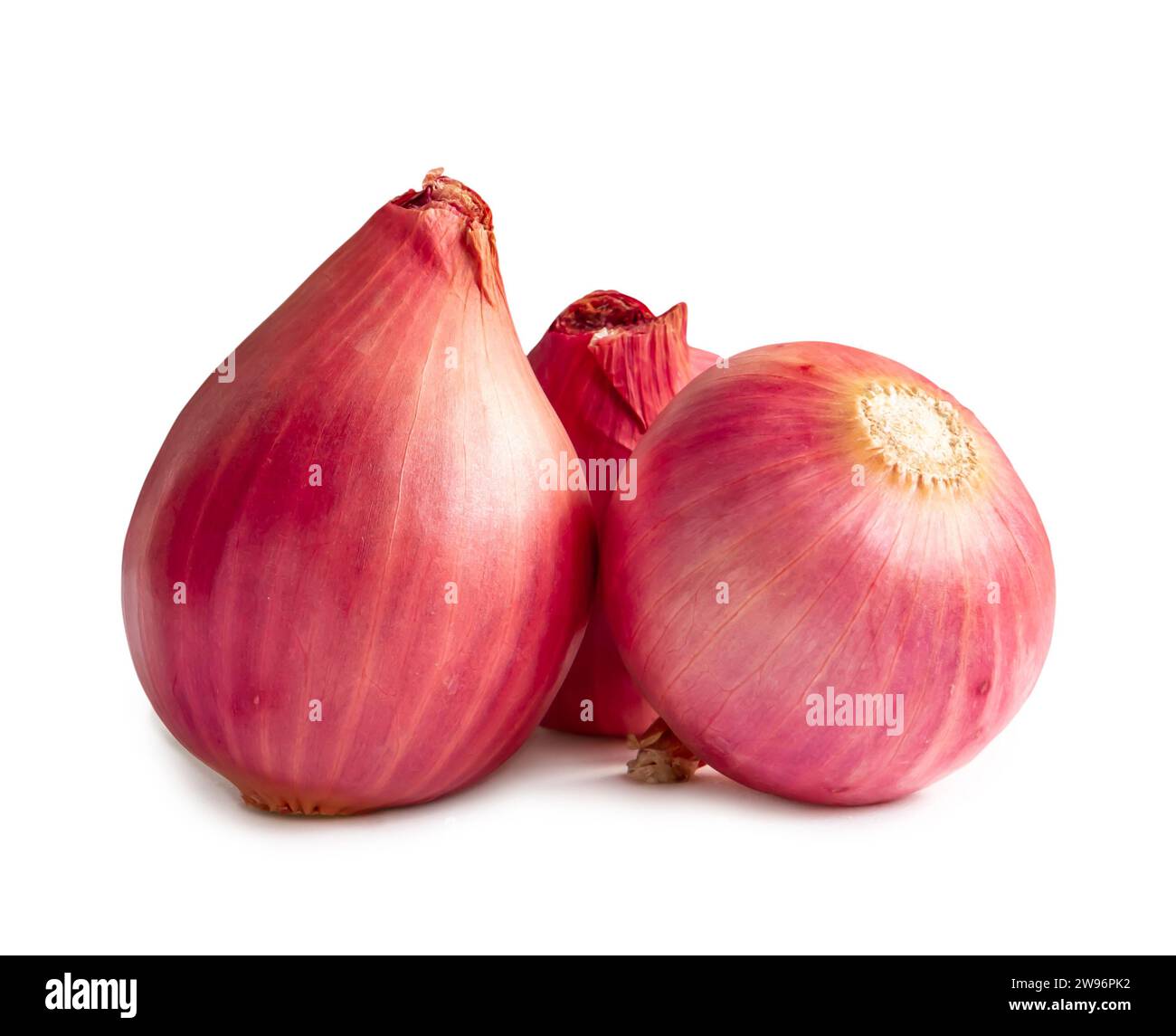 Three fresh red onion bulbs in stack are isolated on white background ...
