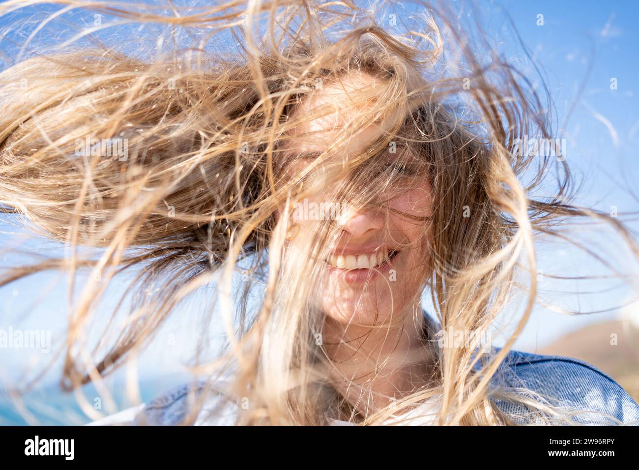 Hair blown in face by wind hi-res stock photography and images - Alamy