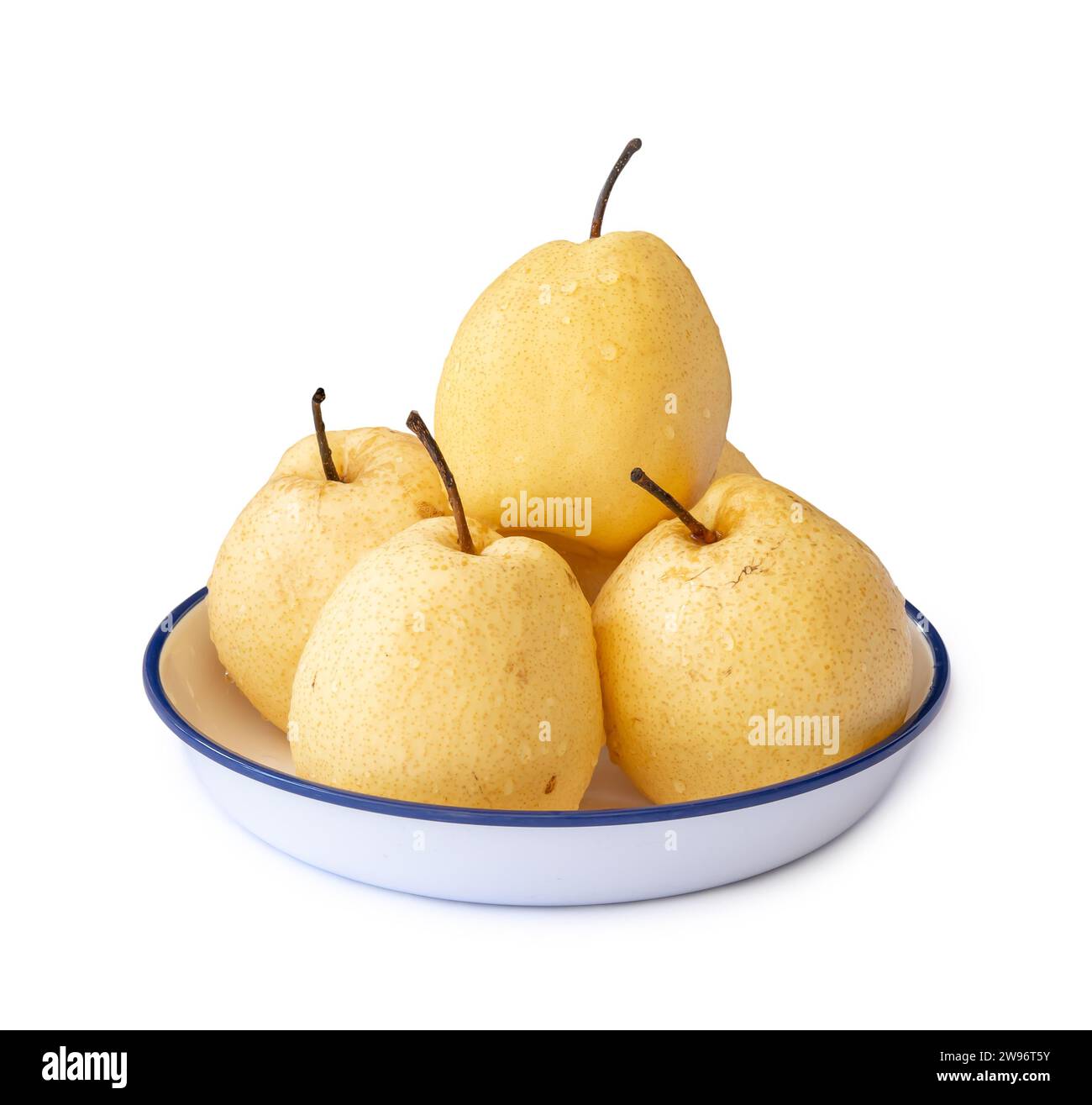Fresh yellow Chinese pears in stack in bowl are isolated on white ...