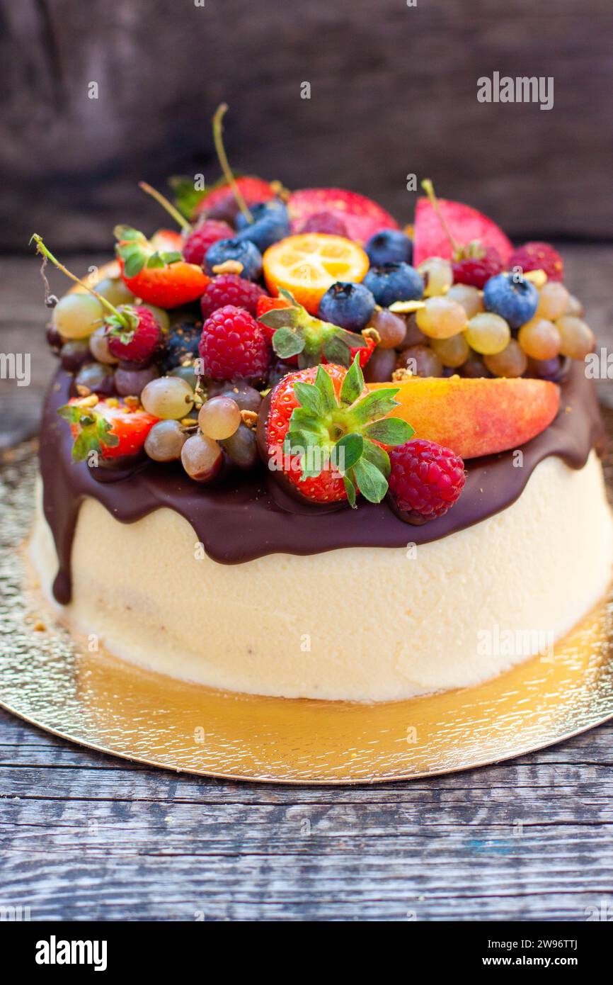 Delicious cheesecake with melted chocolate, apples, strawberries ...