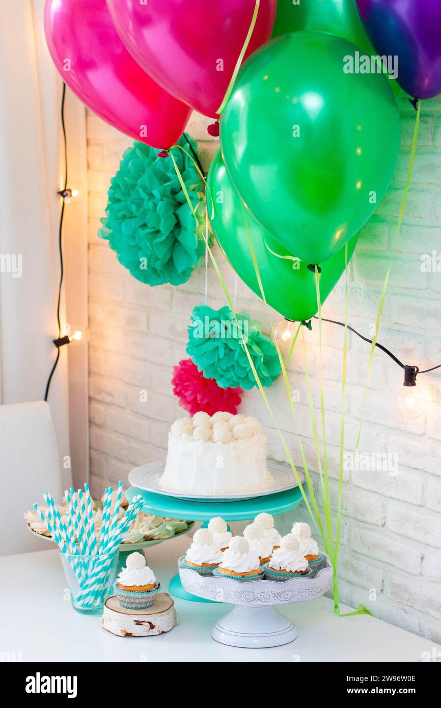 Raffaello coconut almond cake and cupcakes. White, pink and turquoise ...