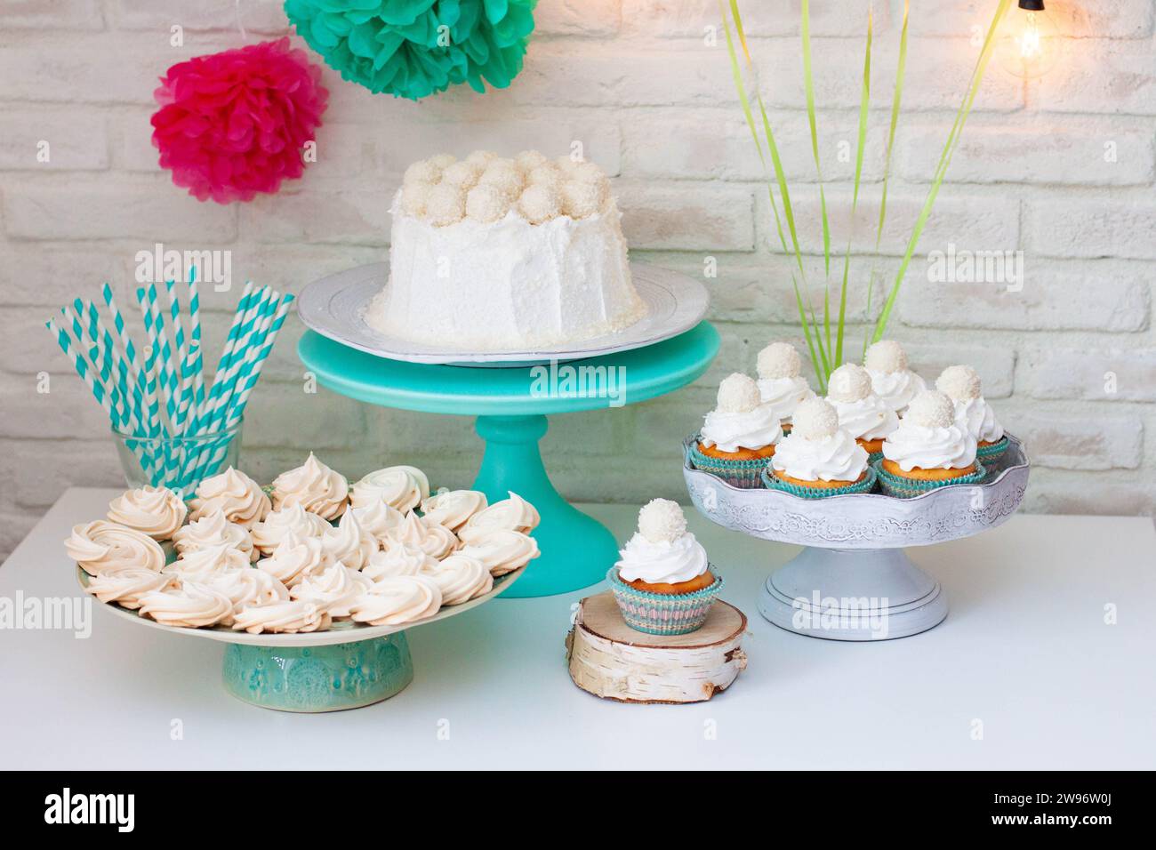 Raffaello coconut almond cake and cupcakes. White, pink and turquoise ...
