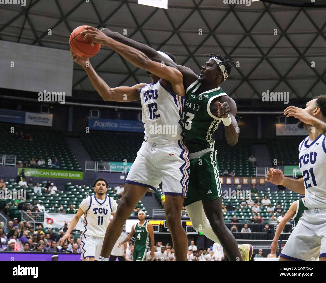 December 24, 2023: TCU forward Xavier Cork (12) gets the rebound during ...