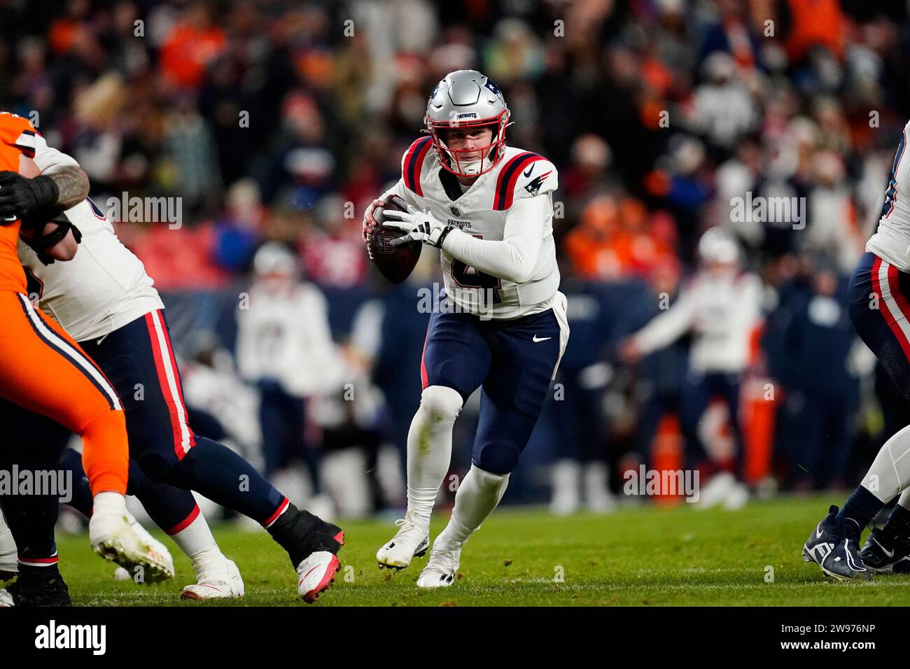 New England Patriots quarterback Bailey Zappe scrambles during the ...