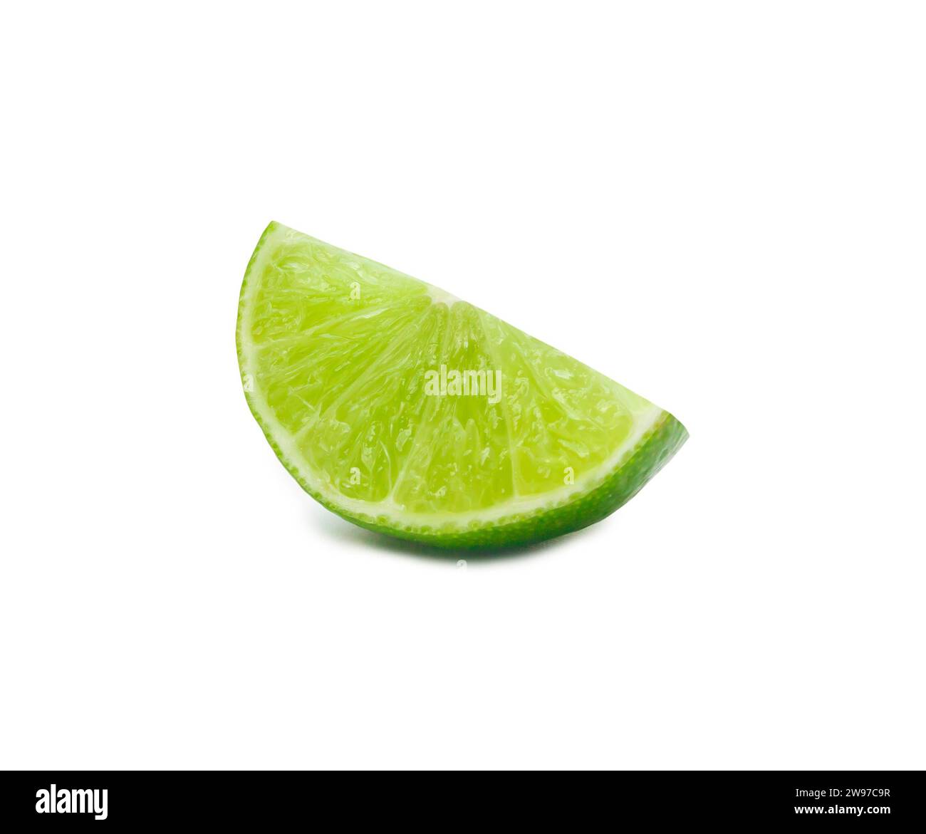 Close up photo of one slice, quarter or piece of green lemon is ...