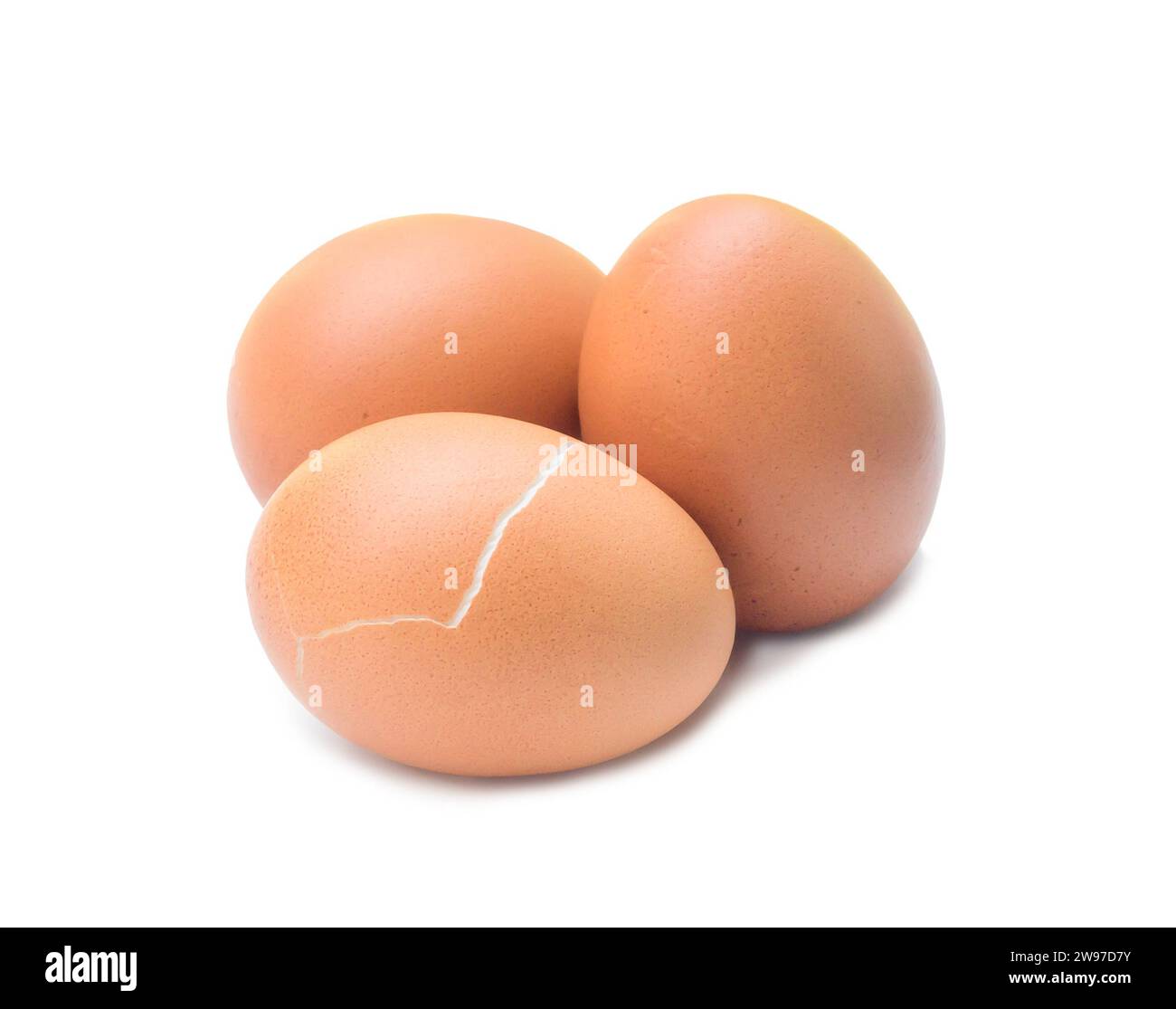 Unpeeled boiled checken eggs with crackle are isolated on white ...