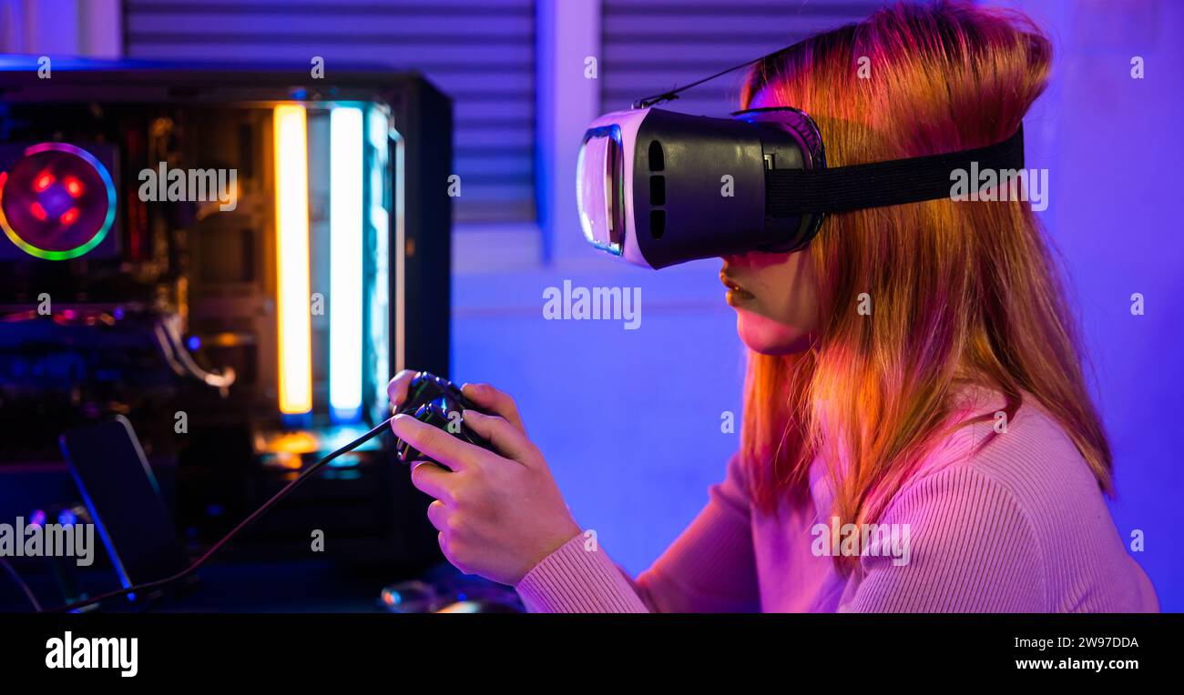 Gamer in VR headset glasses exploring metaverse play video game online ...