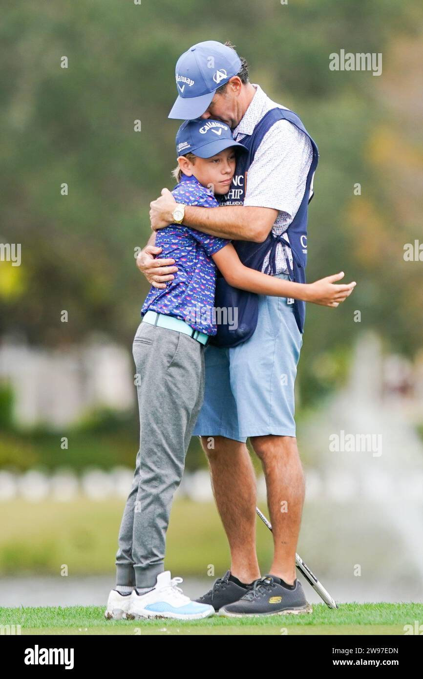 December 17, 2023, Orlando, Florida, USA: Mike McGee (R) and his son ...