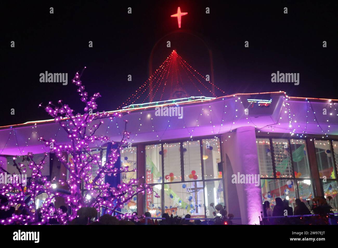 Dhaka, Bangladesh. 25th Dec, 2023. The holy Rosary Church is illuminated with decorative lights ...