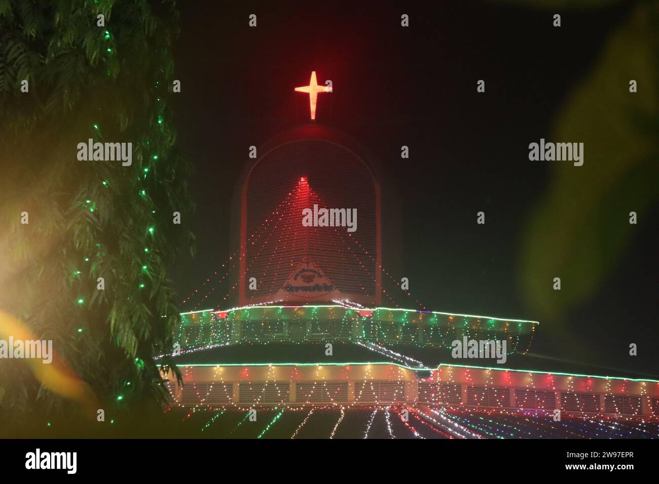 Dhaka, Bangladesh. 25th Dec, 2023. The holy Rosary Church is illuminated with decorative lights ...