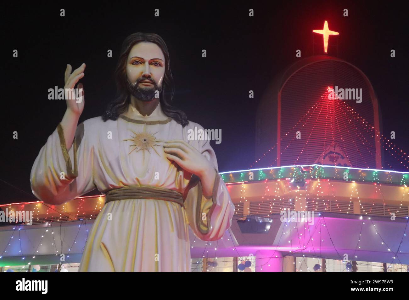 Dhaka, Bangladesh. 25th Dec, 2023. The holy Rosary Church is illuminated with decorative lights ...