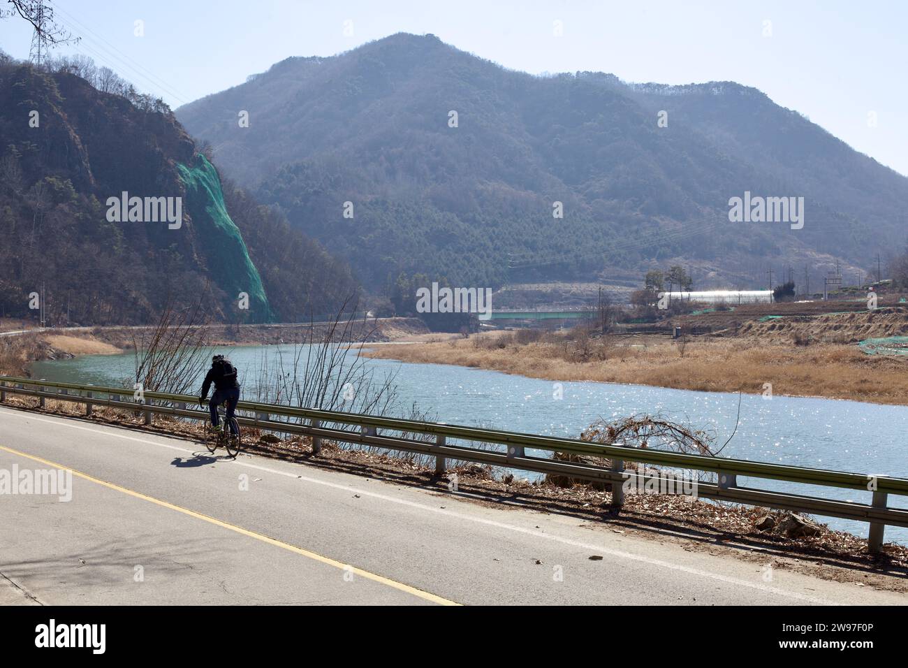 Chungju, South Korea - February 22nd, 2022: Cyclists traversing scenic ...