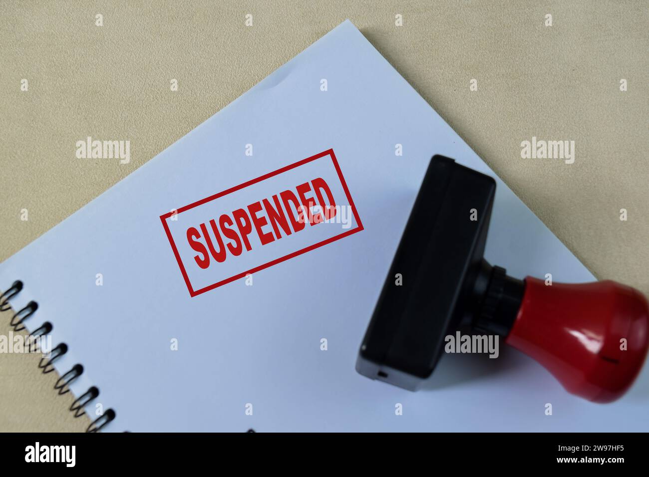 Red Handle Rubber Stamper and suspended text isolated on wooden ...