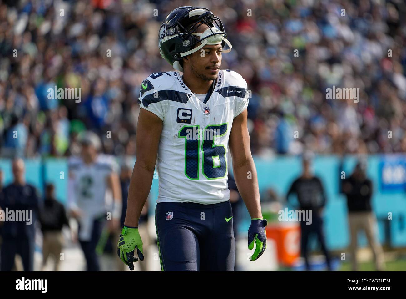 Seattle Seahawks wide receiver Tyler Lockett (16) walks to the huddle ...