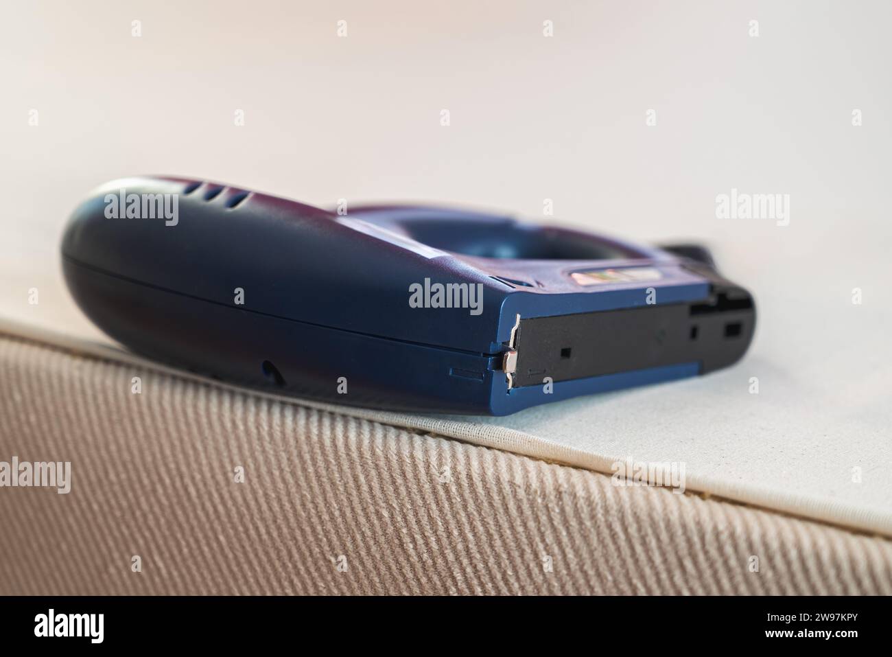 Worker stapling sofa lining with electric staple gun Stock Photo - Alamy