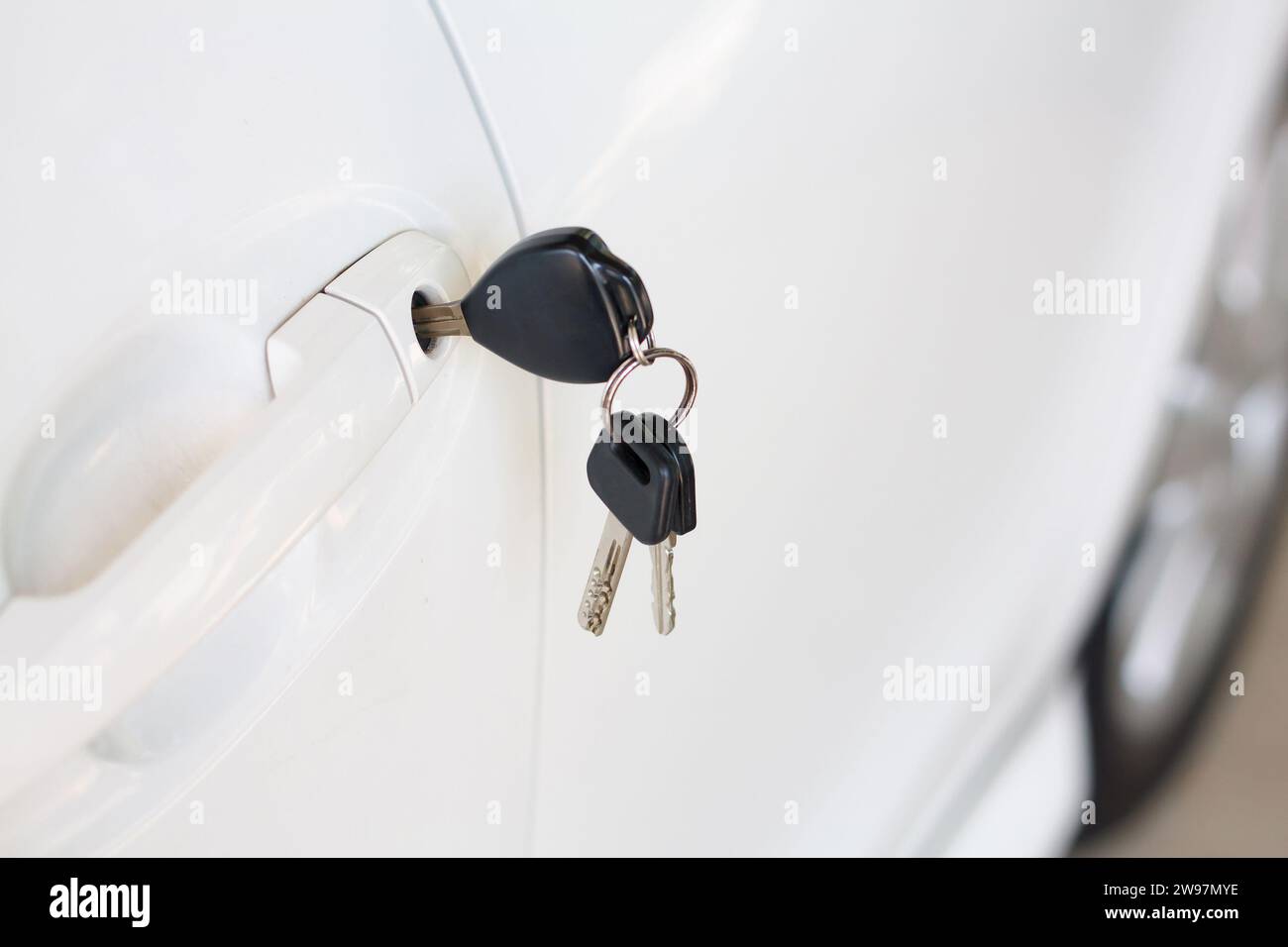 Car keys left in the car door Stock Photo - Alamy