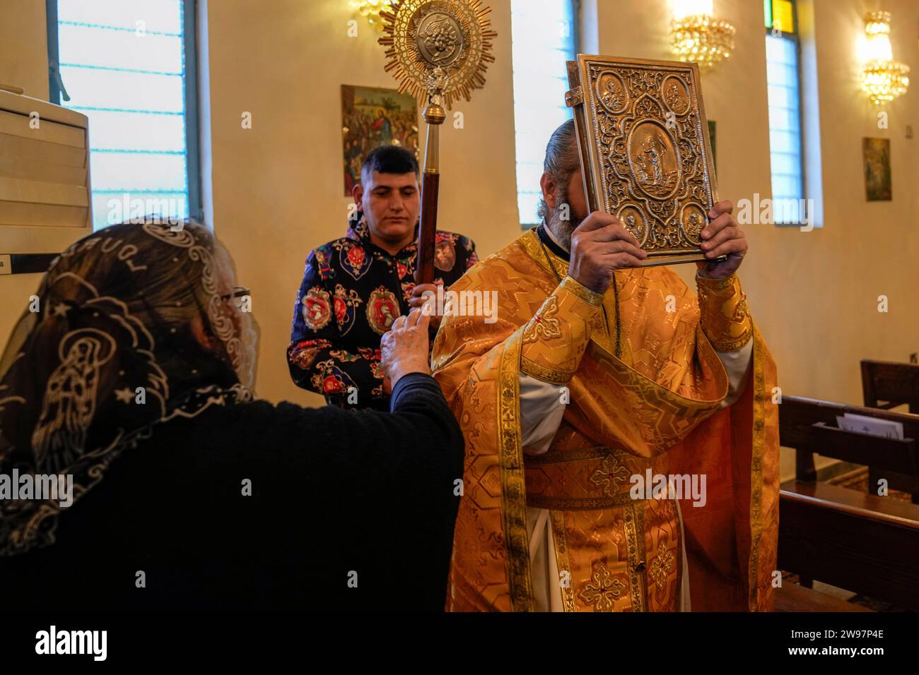 Iraqi Christians attend a Christmas mass at Greek Orthodox Saint ...