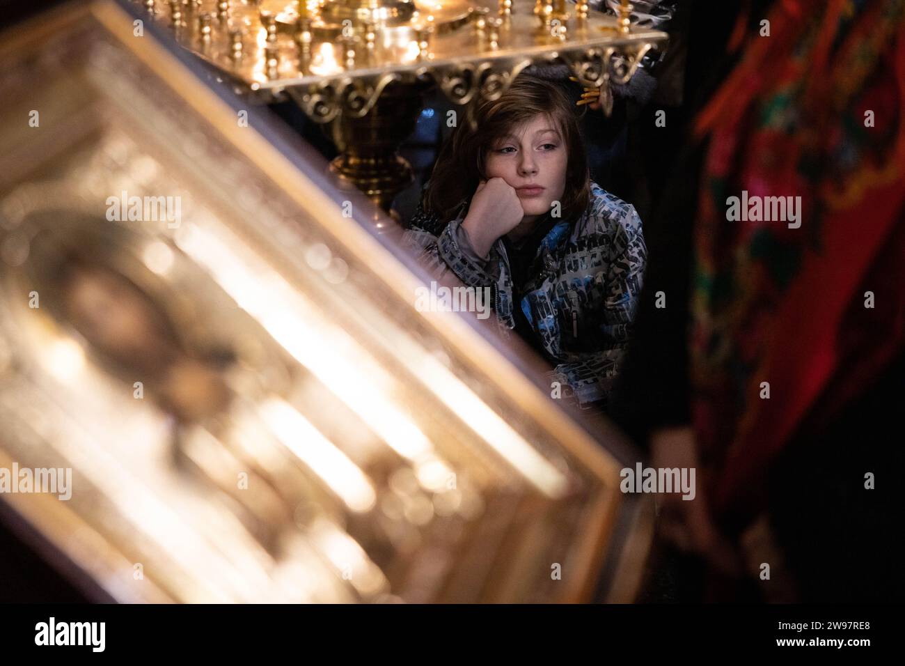 Kyiv, Ukraine. 24th Dec, 2023. A girl attends a Christmas Eve service ...
