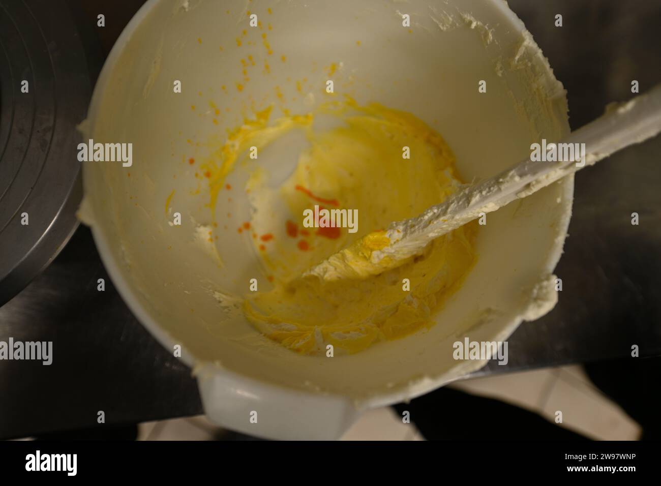 pastry chef prepare edible color cheese cream and spatula for frosted ...