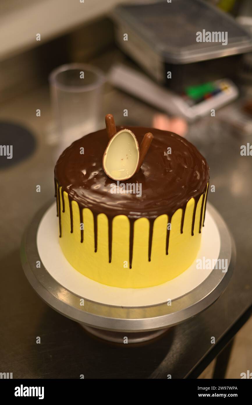 pastry chef smooth prepare sculpt yellow dripping frosted layered dark ...
