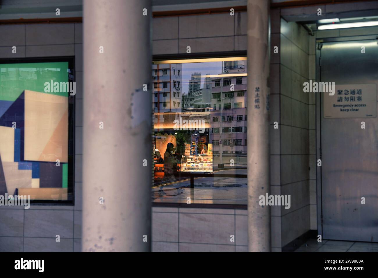 A glass window of a store in Hong Kong Stock Photo - Alamy