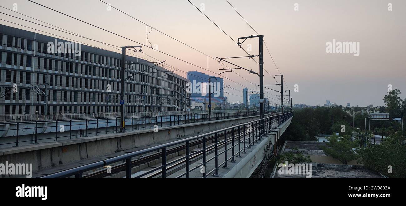 An aerial view of a modern train travelling along a railway track that ...