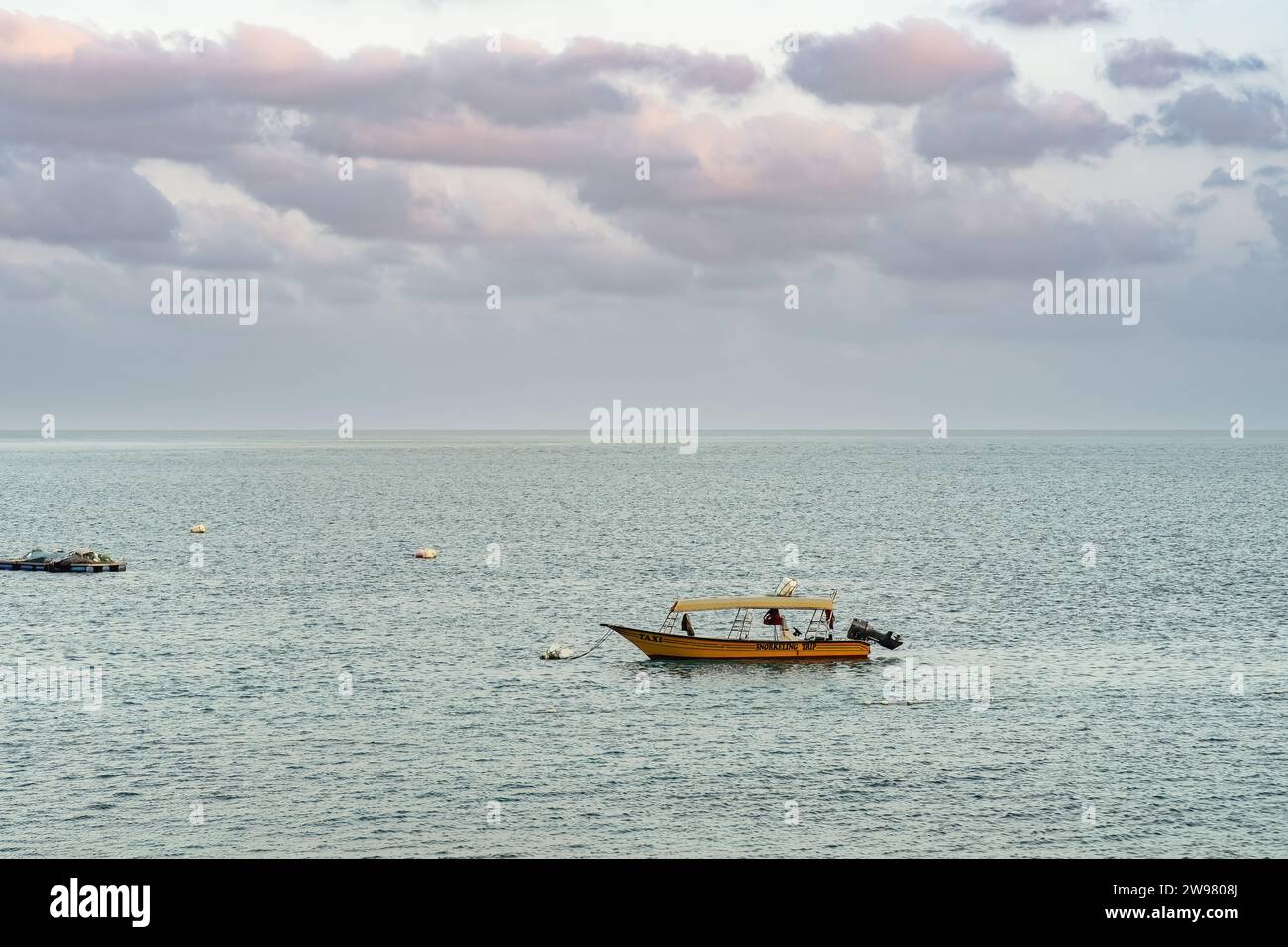 An empty boat floating during sunrise in Perhentian Island, Terengganu ...