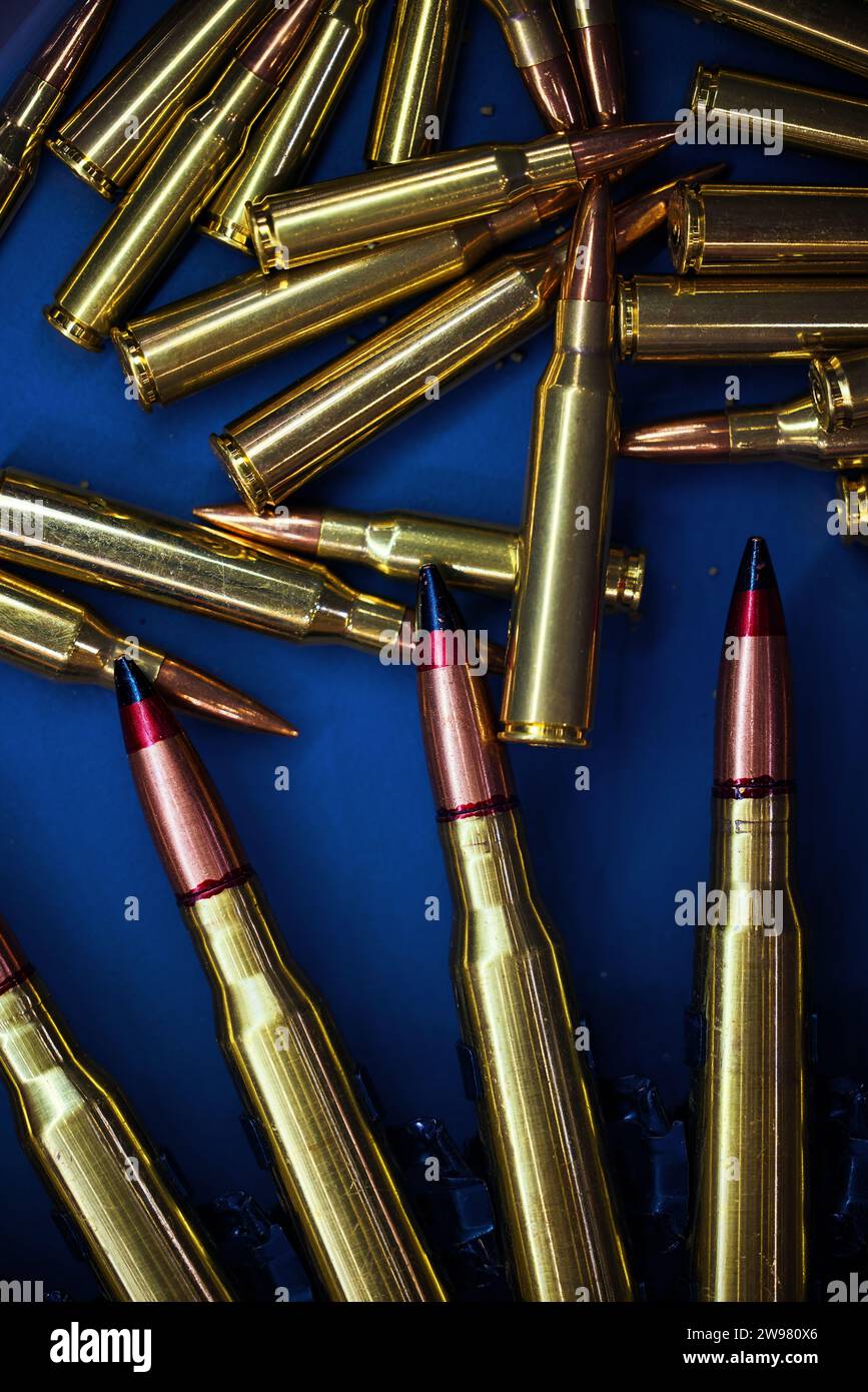 Ammunition for the machine gun and rifle are scattered on the table ...