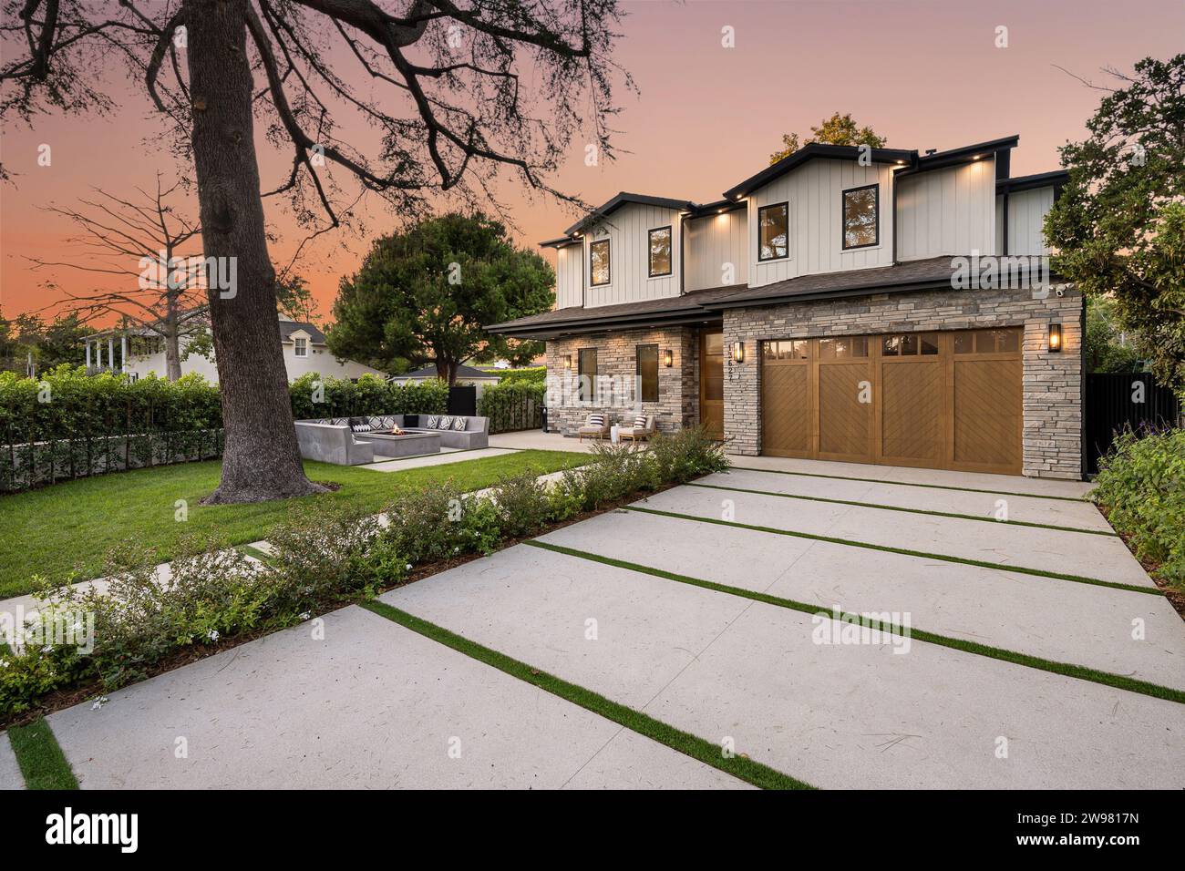 A majestic residence against a tranquil suburban backdrop, illuminated ...