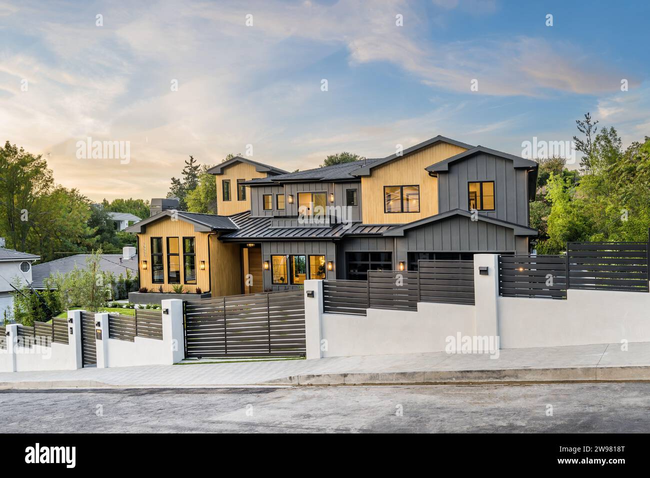 A majestic residence against a tranquil suburban backdrop, illuminated ...