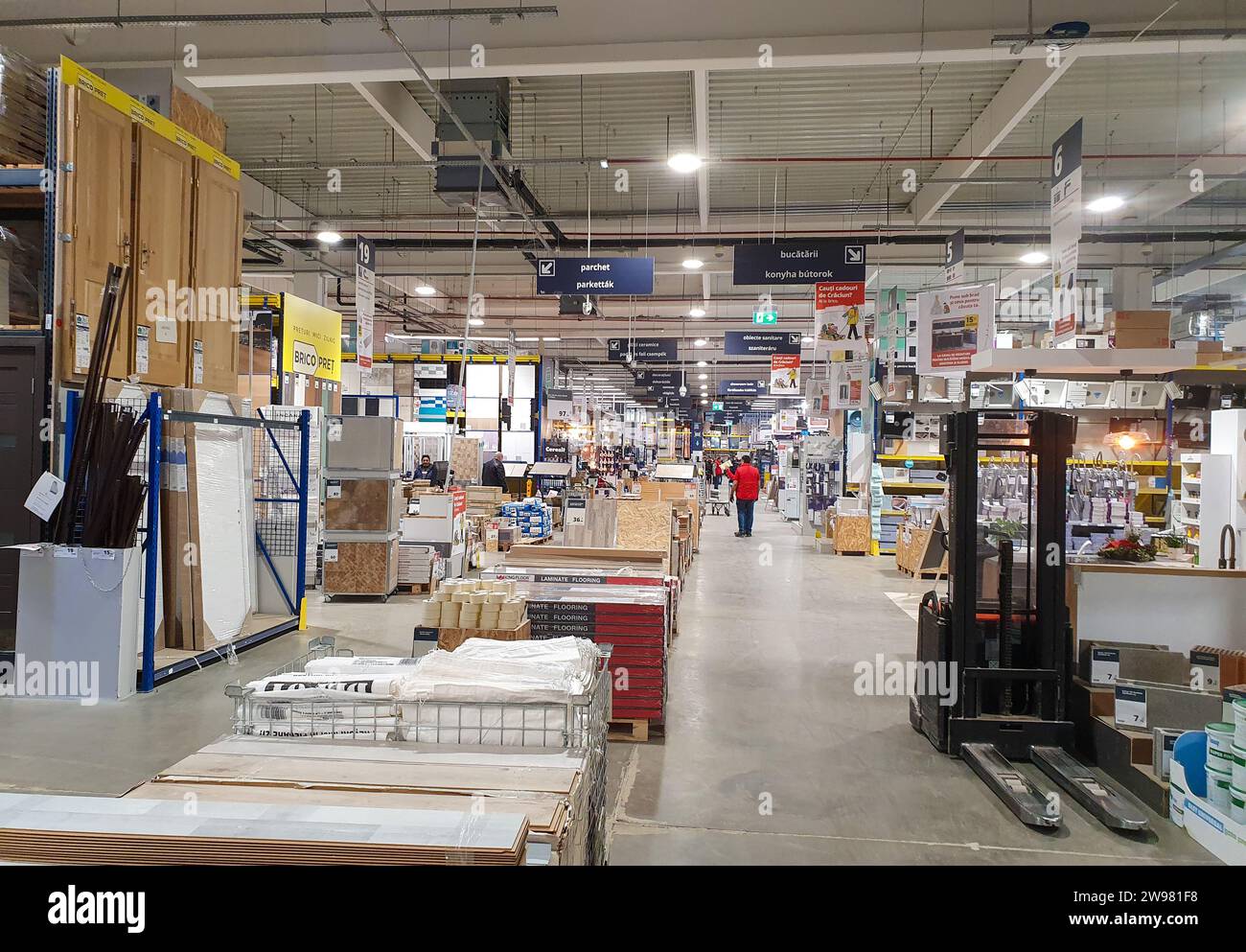 An interior image of a store aisle with multiple shelves Stock Photo ...