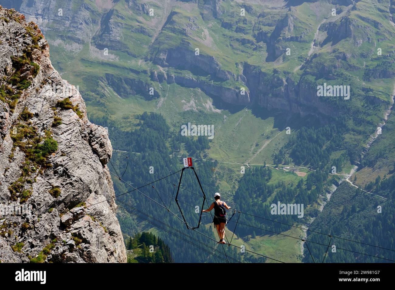 A woman on a via ferrata trail in Valais, Switzerland Stock Photo - Alamy