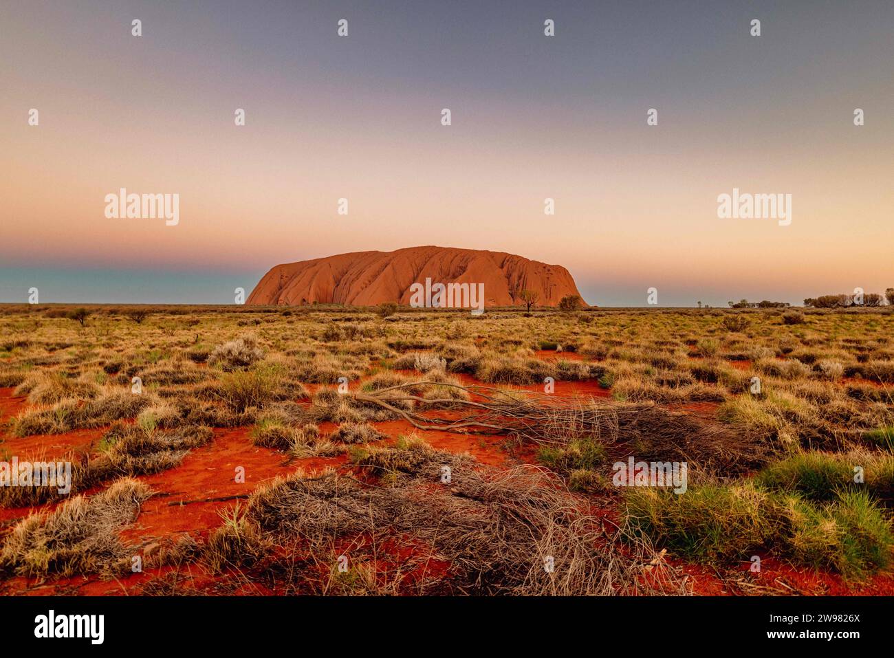 A scenic view of Uluru, a large sandstone formation in the center of ...