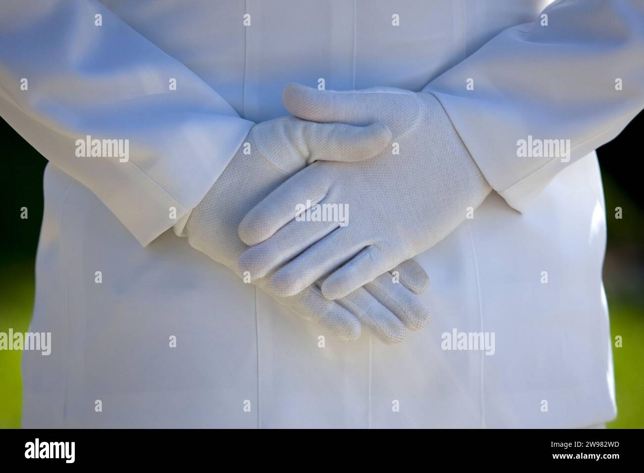 A Navy man's hands behind his back Stock Photo - Alamy