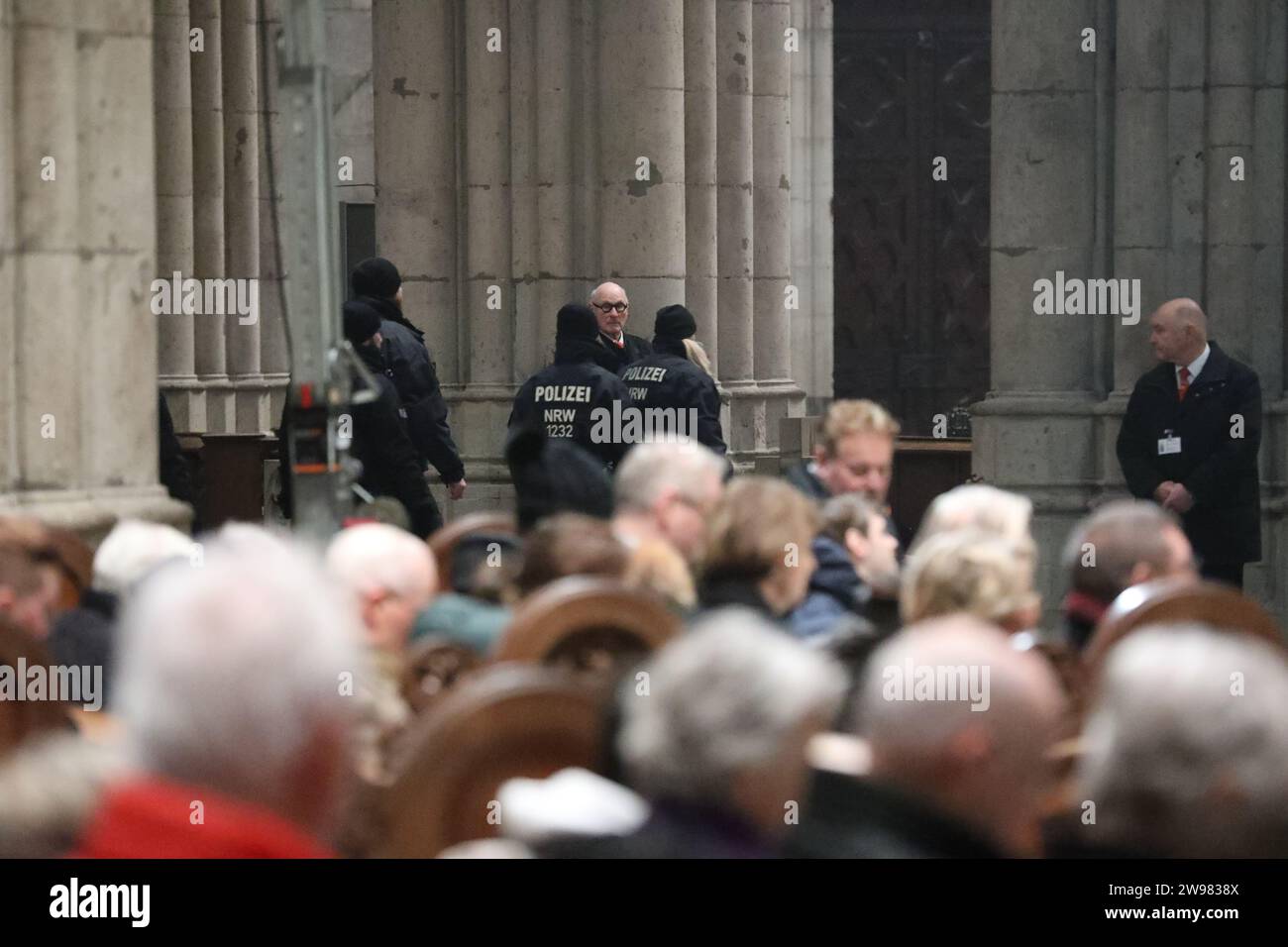 Cologne, Germany. 25th Dec, 2023. Police officers walk through Cologne ...