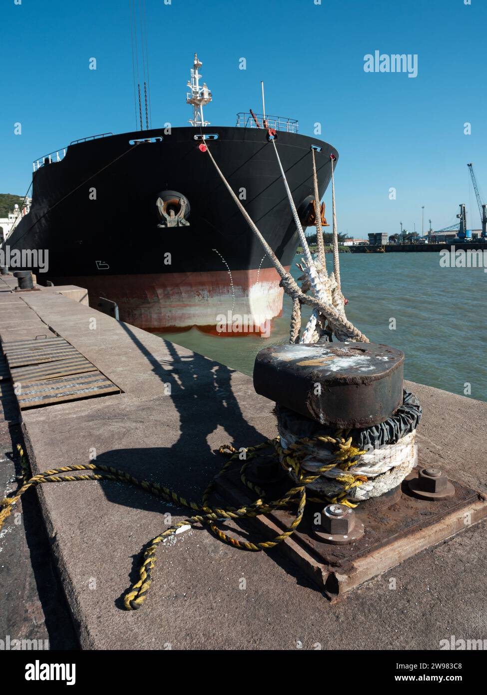 wide angle view of cargo ship mooring ropes in grain loading port Stock ...