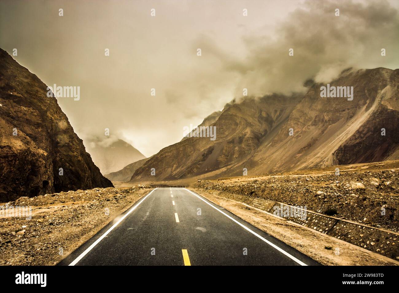 Road winding through the mountains Stock Photo - Alamy