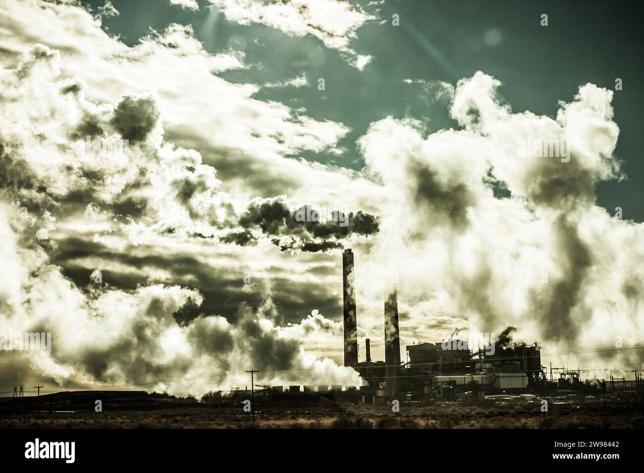 Smoke and steam rising from a coal power plant Stock Photo - Alamy