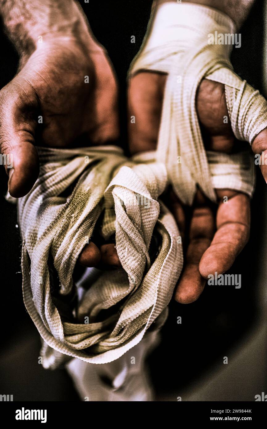 A boxer's hands while unwrapping the tape Stock Photo - Alamy
