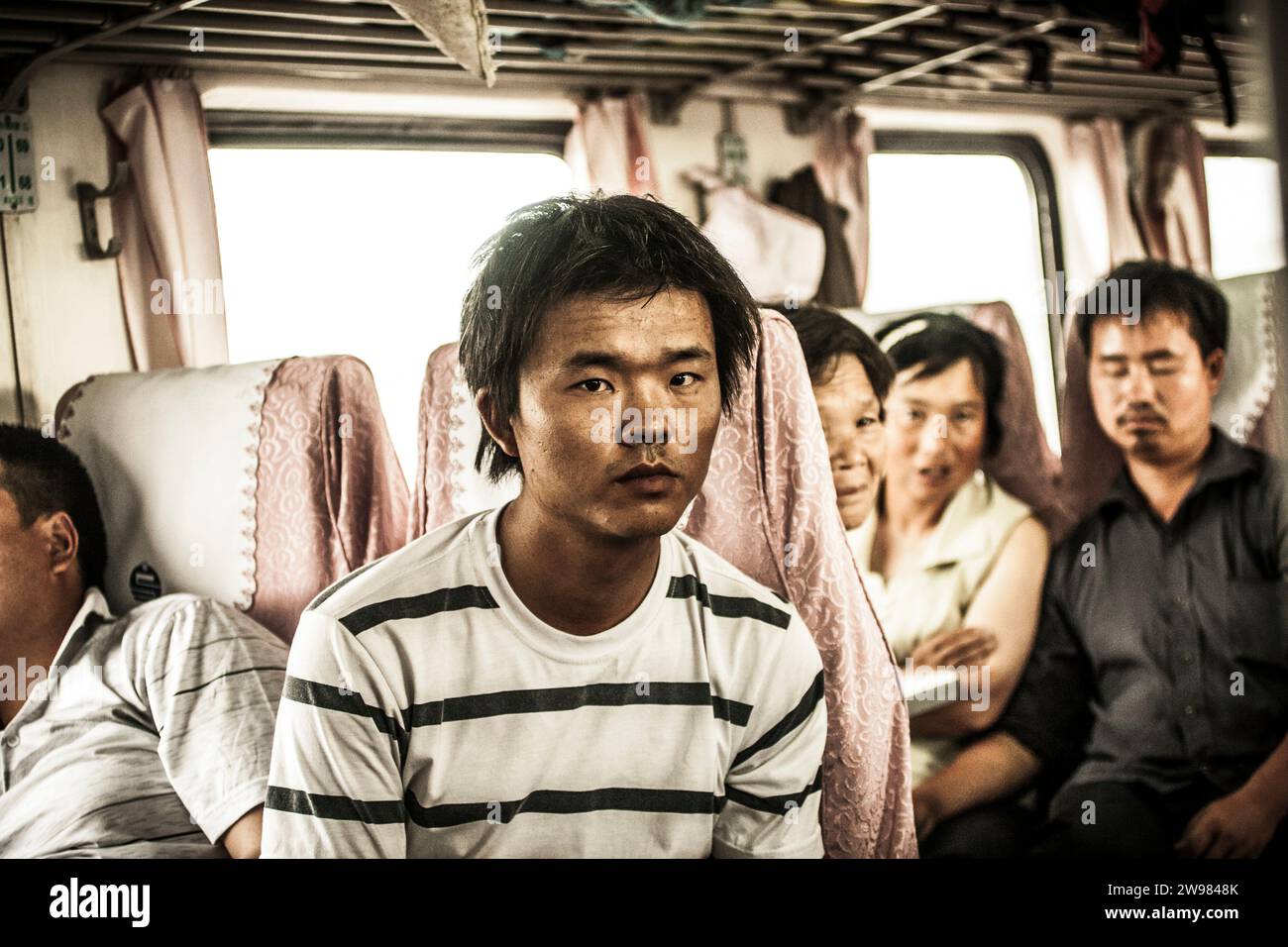 Portrait of a university student on a train Stock Photo - Alamy