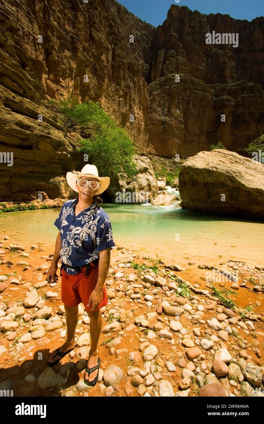 Man wearing cowboy hat and scuba mask at Havasau Canyon in the Grand ...
