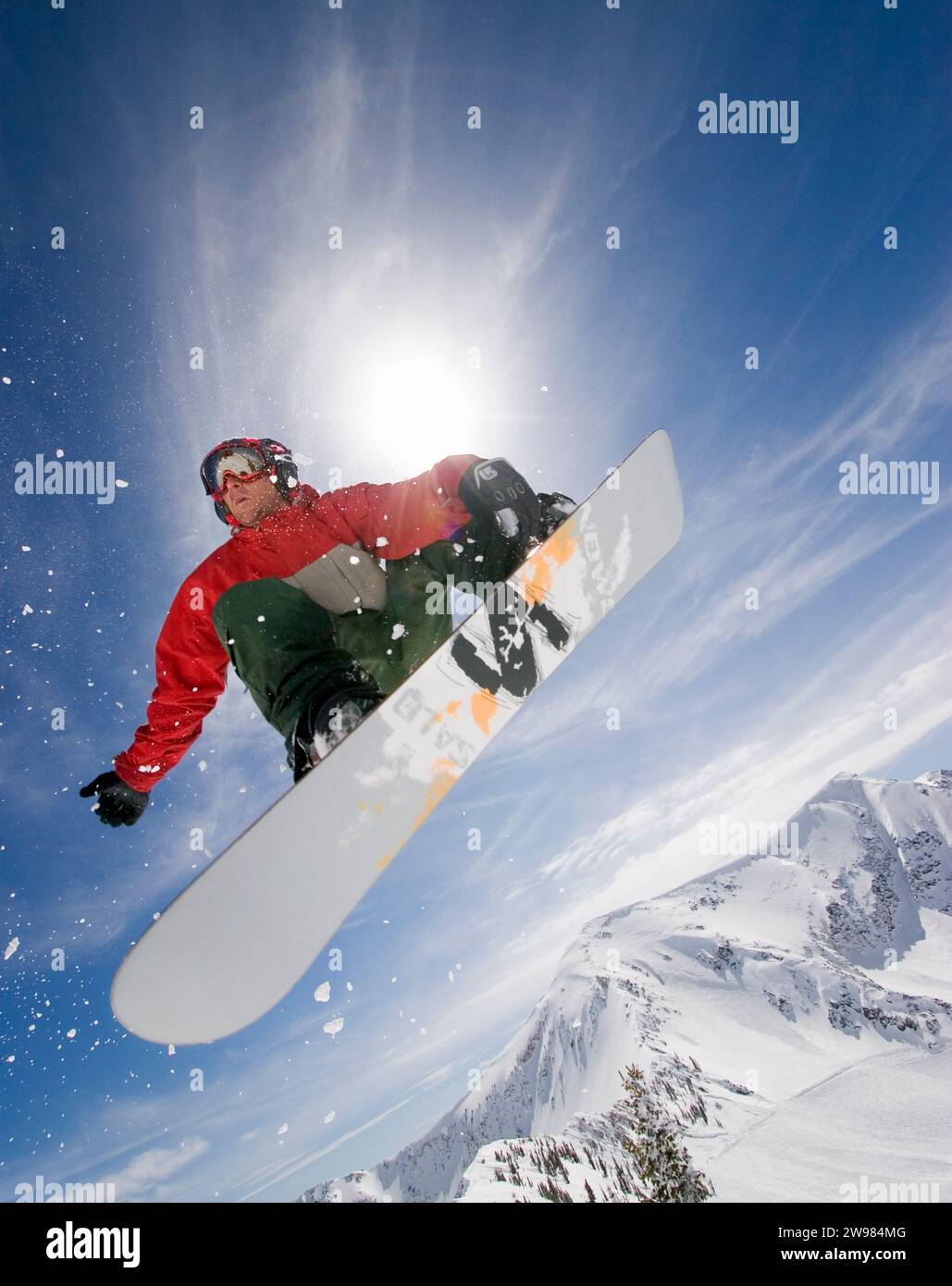 A snowboarder jumping of a cliff at Snowbird, Utah Stock Photo - Alamy