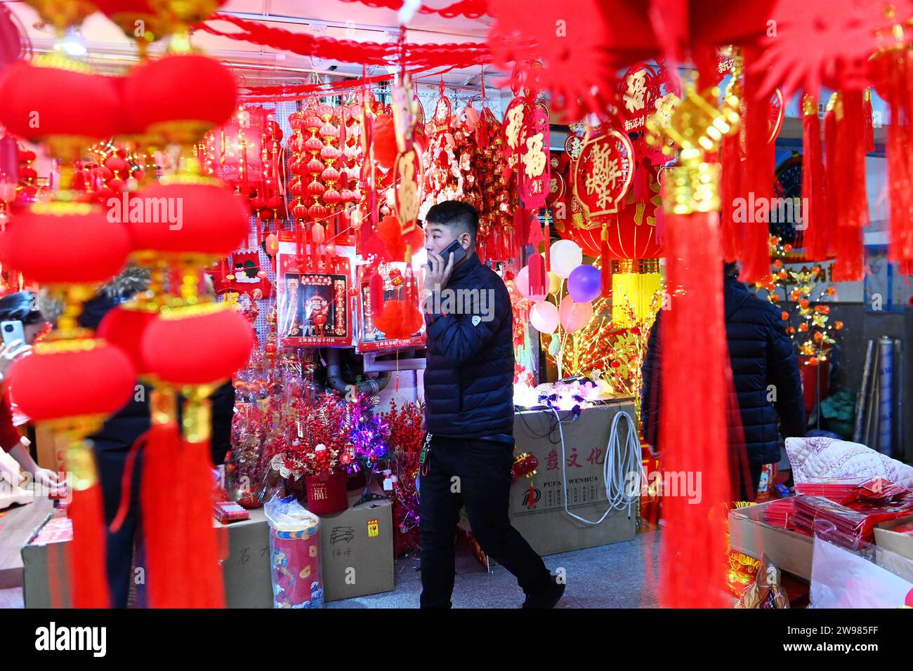 QINGDAO, CHINA - DECEMBER 25, 2023 - A citizen walks past a Spring ...