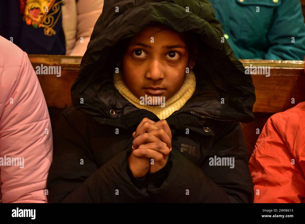 Srinagar, India. 25th Dec, 2023. A Christian devotee prays inside the ...