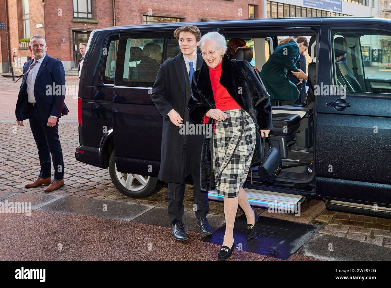 Queen Margrethe is helped by Count Felix when she arrives for high mass ...