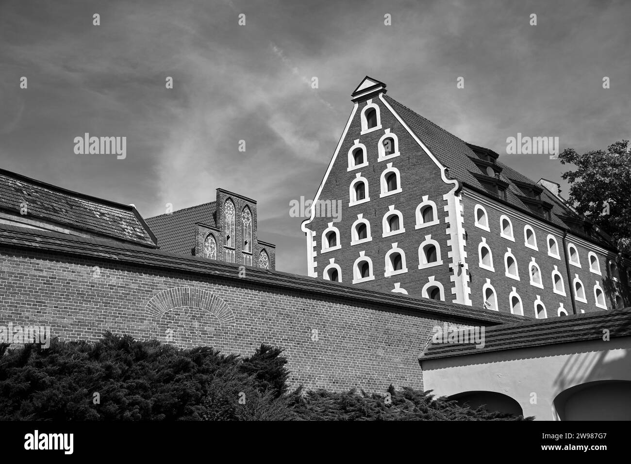 monumental medieval defensive walls and historic brick building in the ...