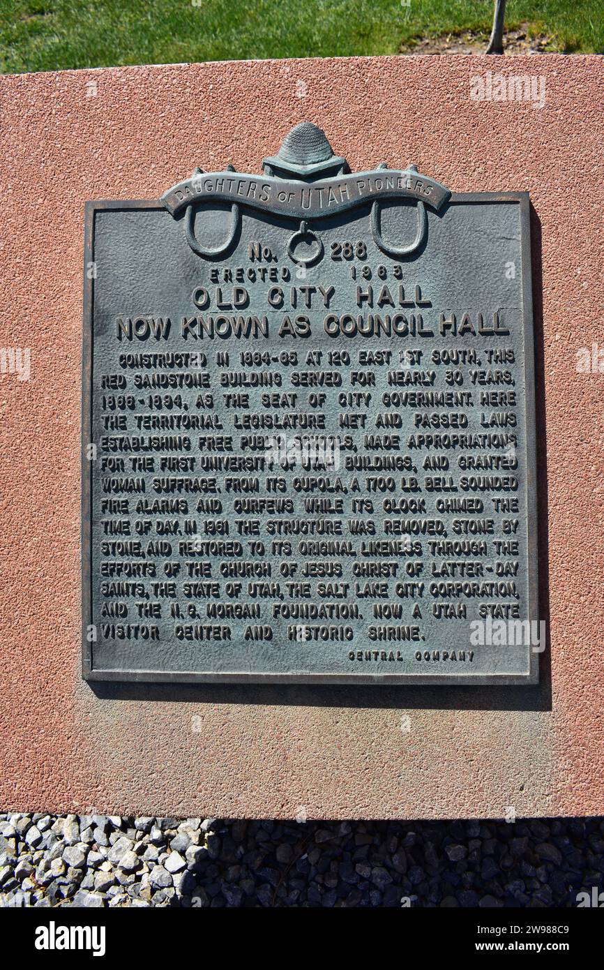 A cast iron metal plate containing information about the Salt Lake City ...