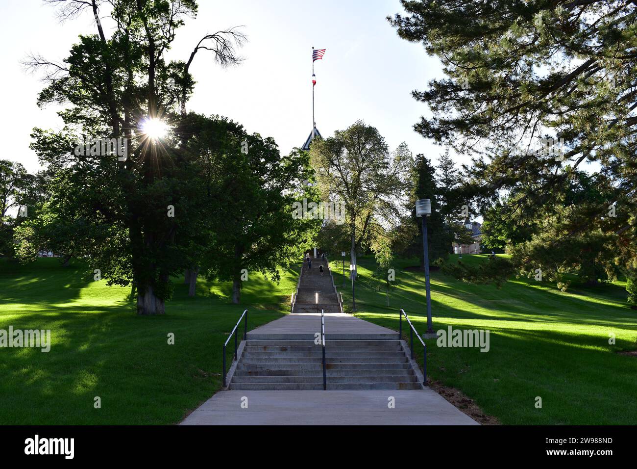 People climbing the stairs up Old Main Hill on a sunny morning at USU campus Stock Photo - Alamy