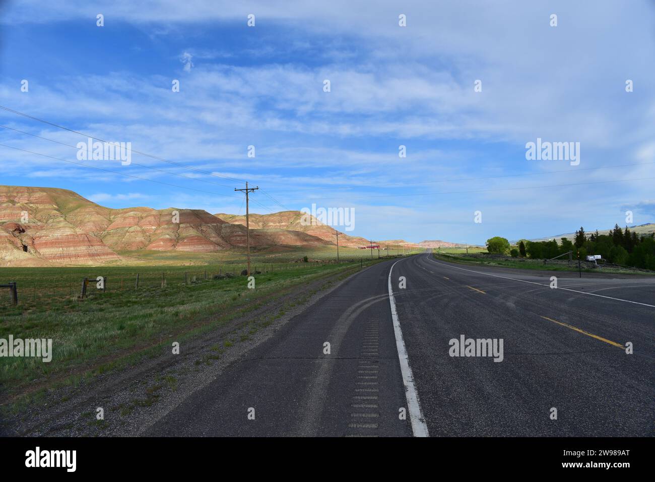 View of Highway 26 and the colorful sedimentary mountains and scenery ...