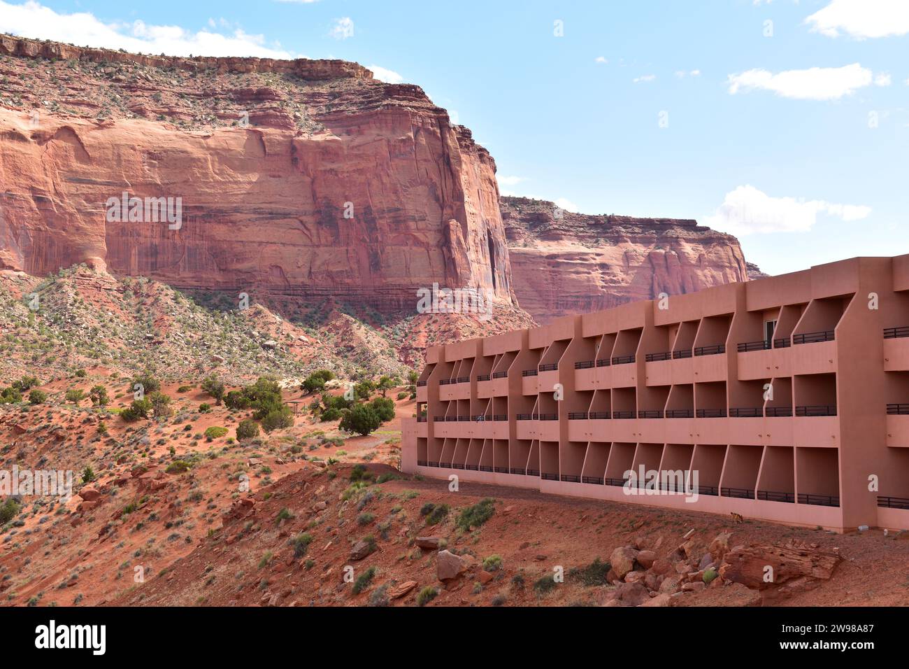 Hotel room balconies in the red sandstone building of 3-star hotel The ...